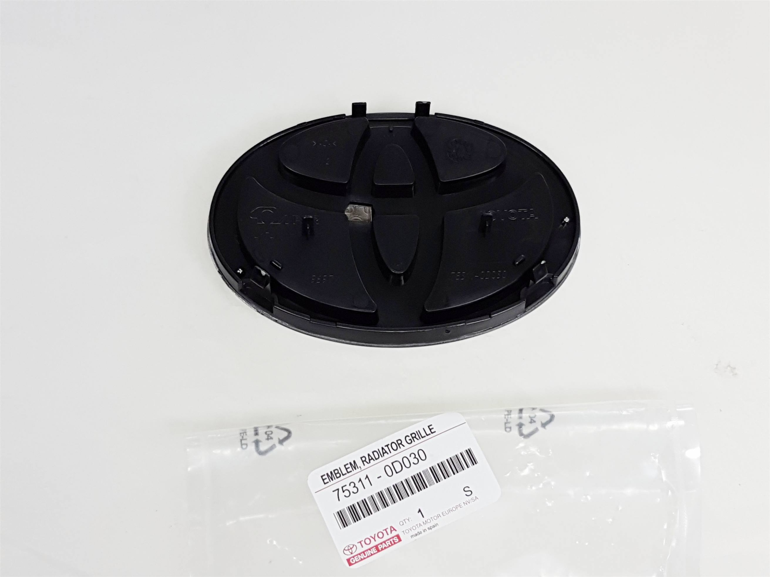 A75311-0D030 - YARIS II 05-11 ЗНАЧОК ЛОГОТИП ЕМБЛЕМА ПЕРЕДНІЙ БАМПЕР ...